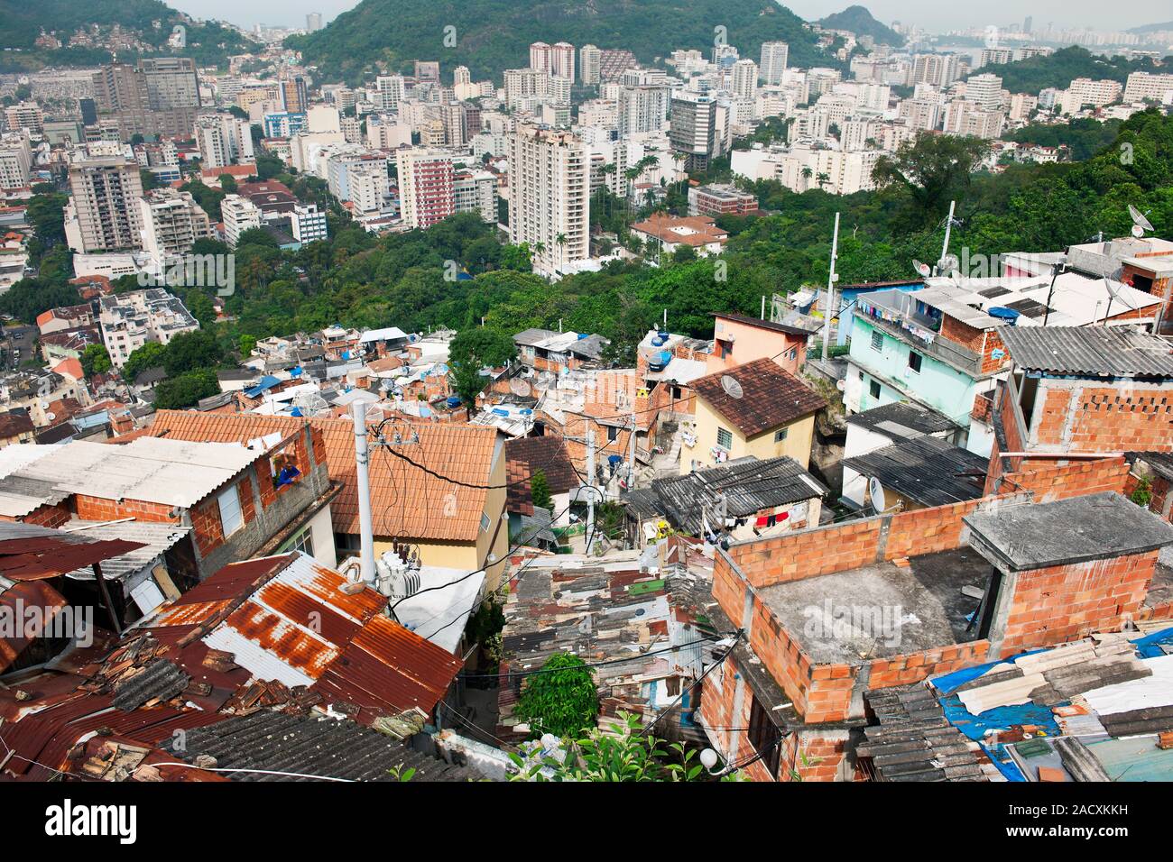 Favela in Rio de Janeiro, Brazil. In the foreground are buildings in a ...