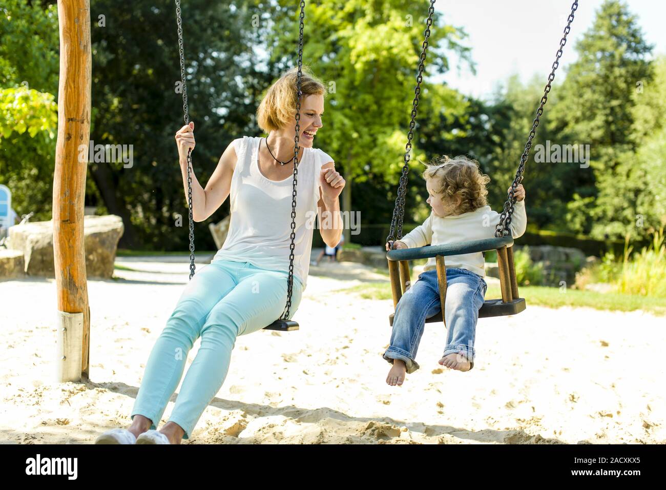 Playground swing hi-res stock photography and images - Alamy