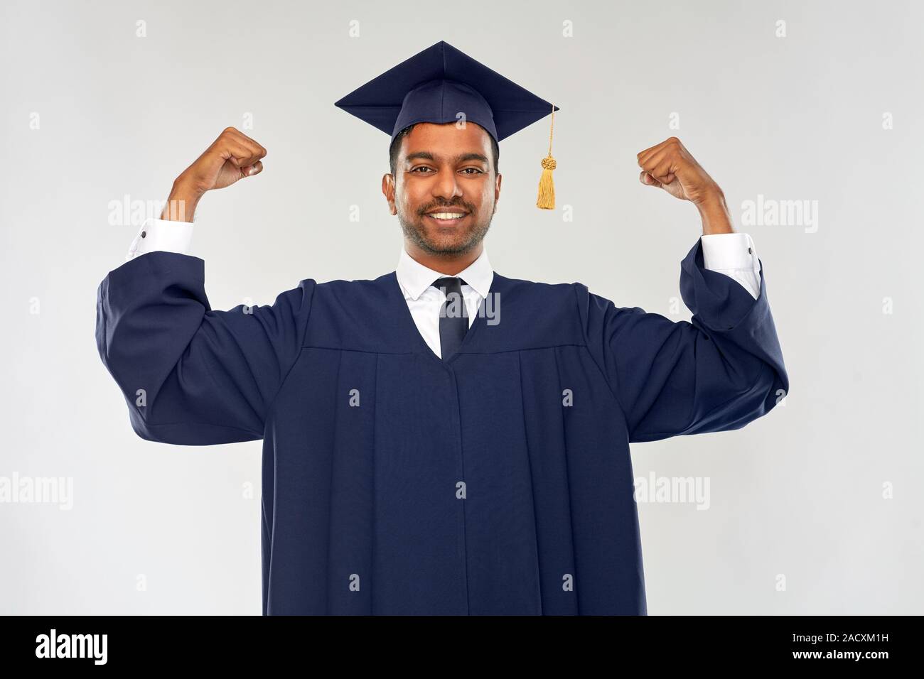 education, graduation and people concept - happy smiling indian male ...
