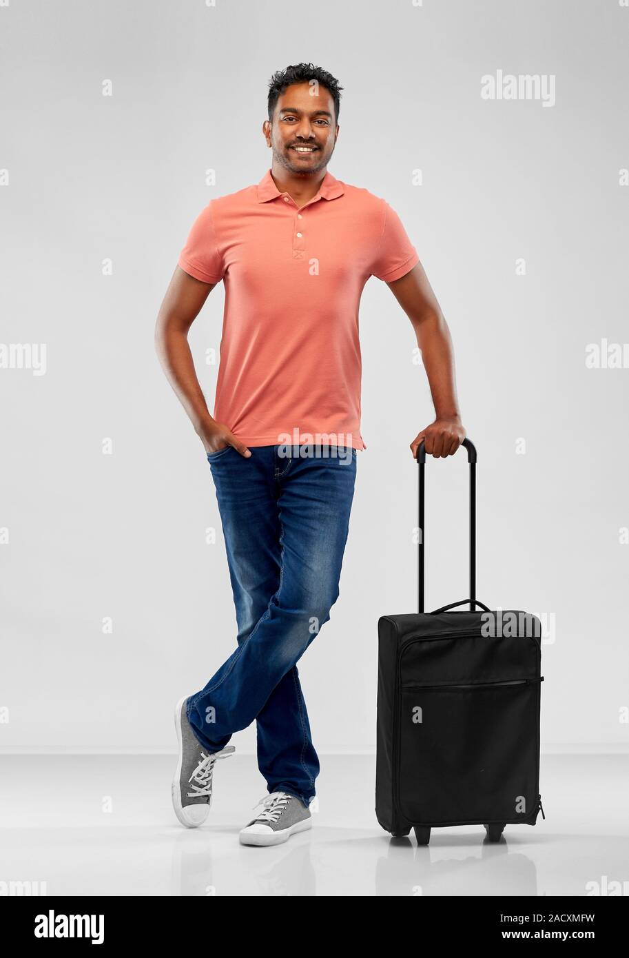 family, tourism and vacation concept - smiling indian man in polo shirt ...
