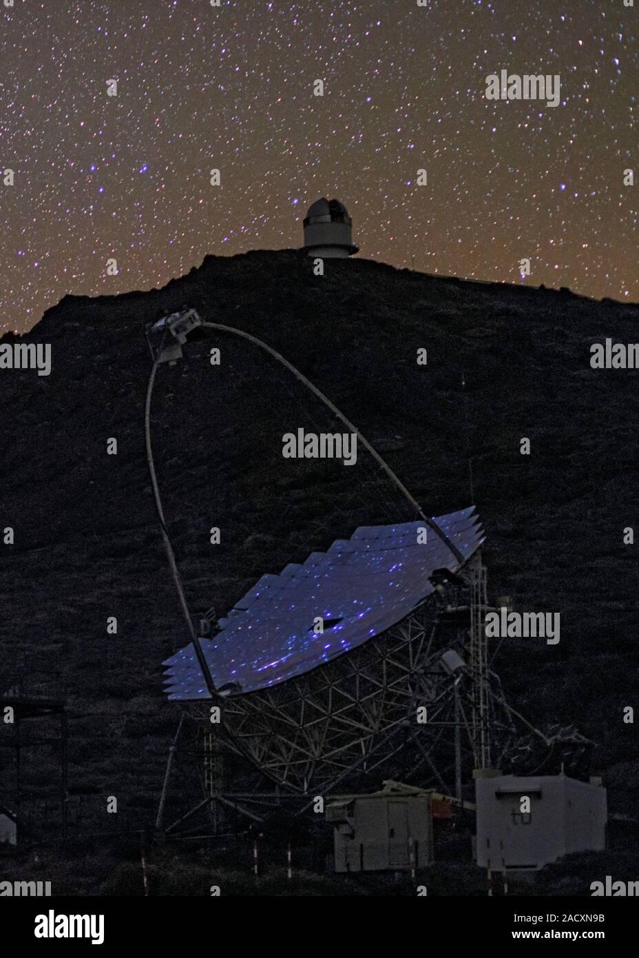 View of night sky reflected in the multi-mirrored surface of one of a ...