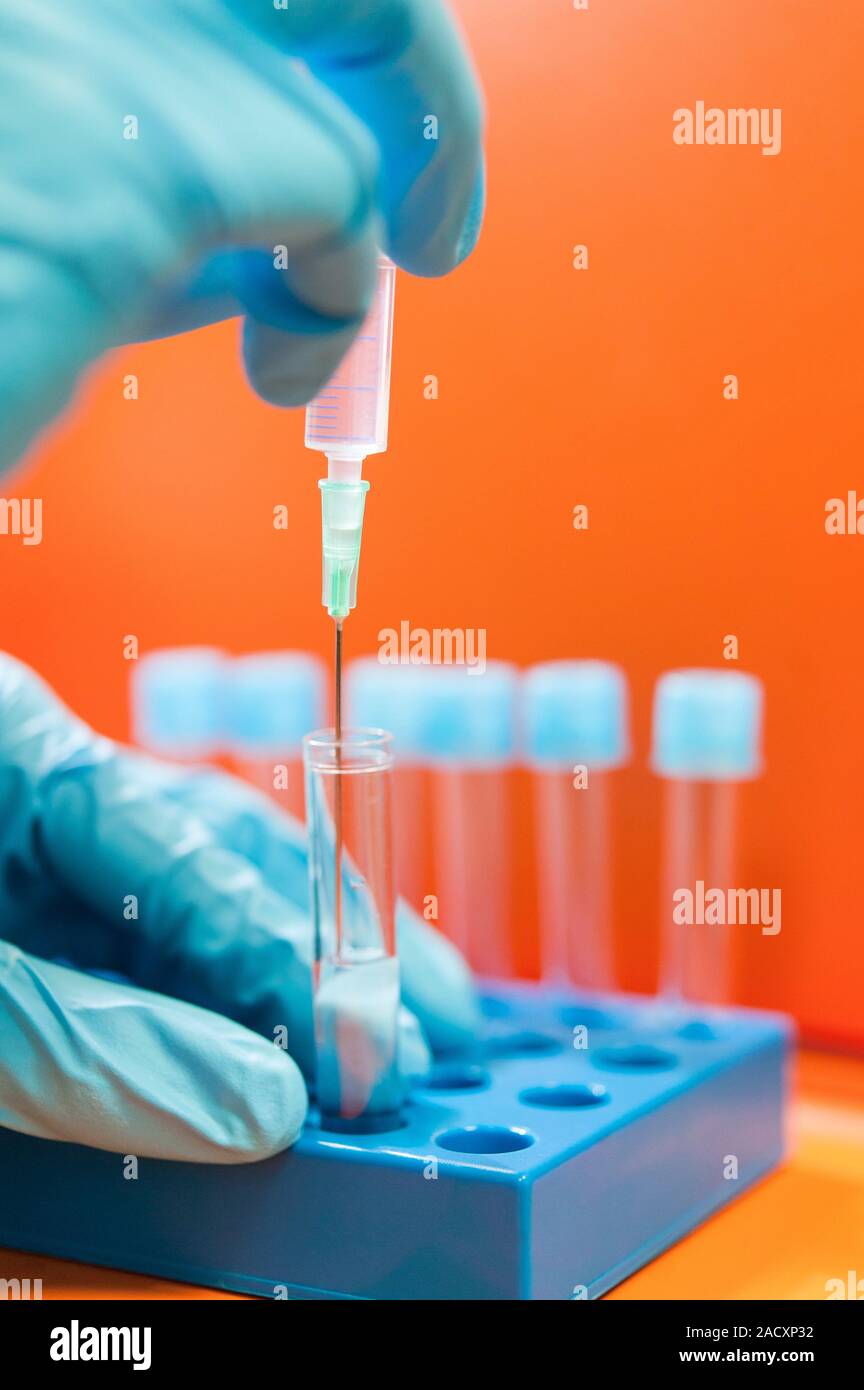 Mass cytometry sample preparation. Close-up of a researcher preparing a ...