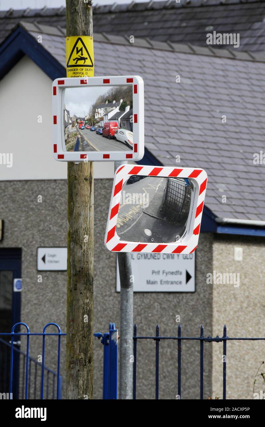 Convex traffic mirrors at a junction. These safety mirrors provide a ...