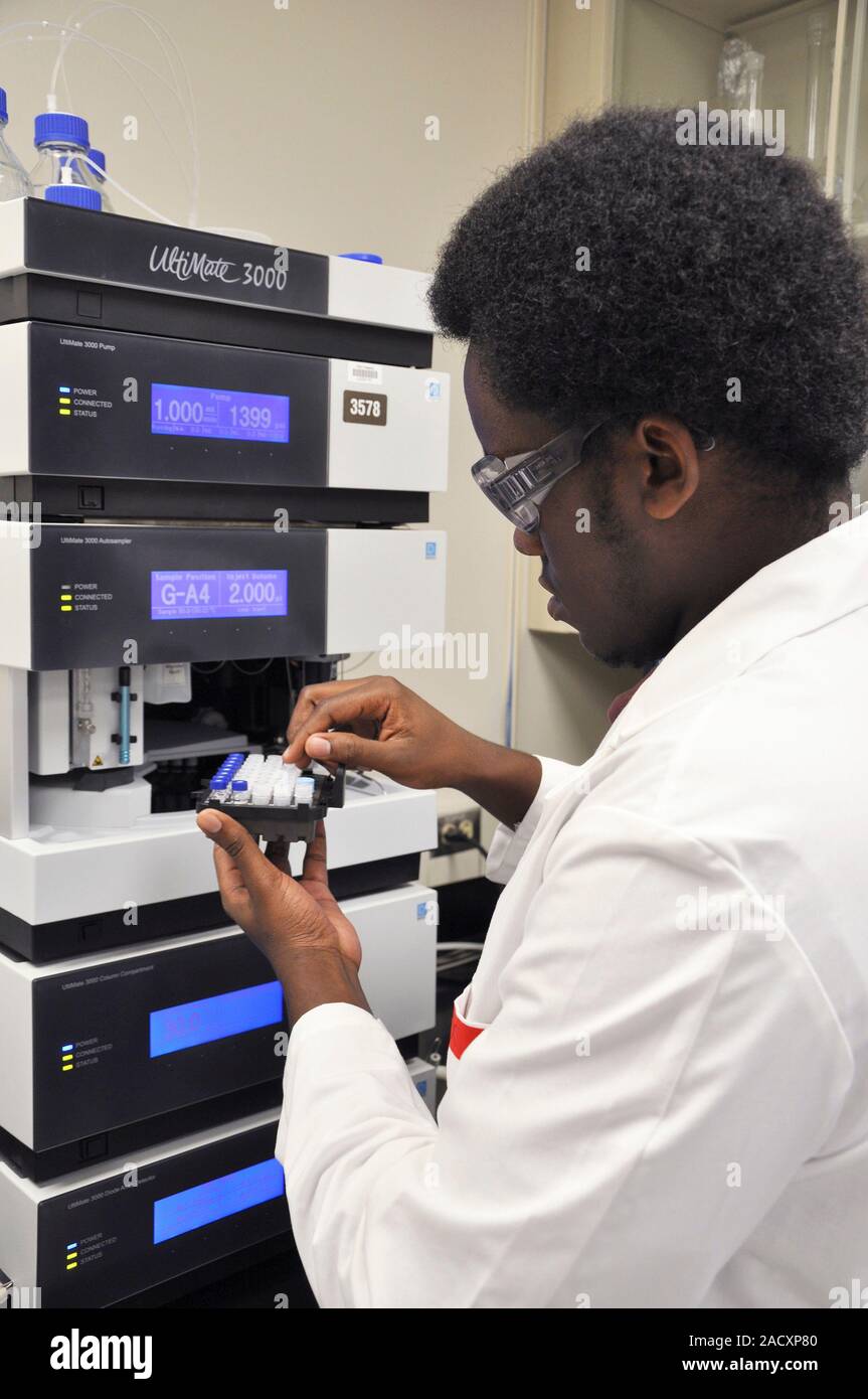 Editorial use only Toxicology research. Scientist loading a sample for ...