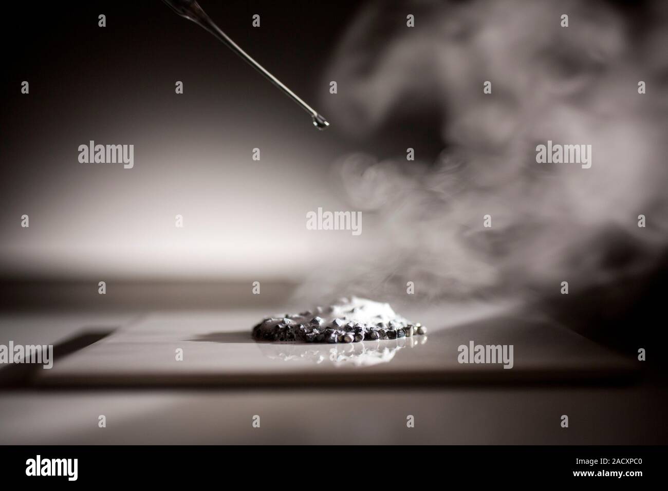 Lithium reacting with water. Lithium (Li) is a highly reactive metallic ...