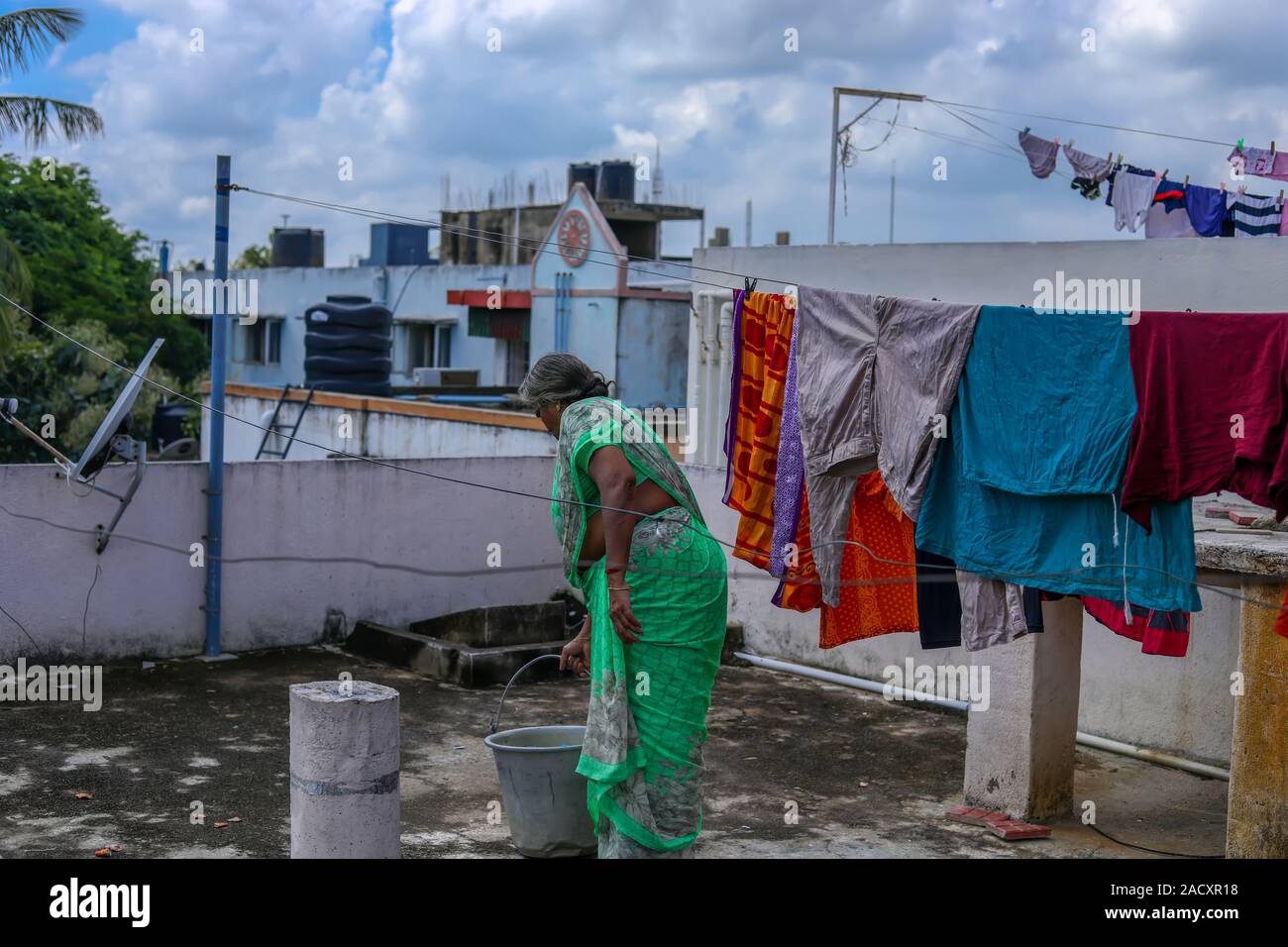 Woman hanging clothes on washing lines Stock Photo - Alamy