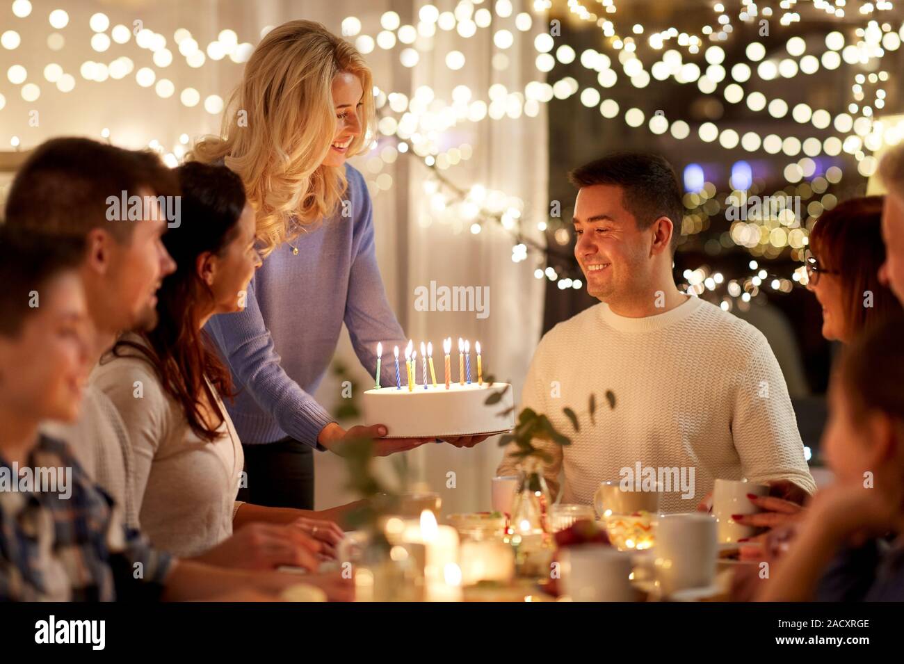 celebration and people concept - happy family with cake having birthday ...