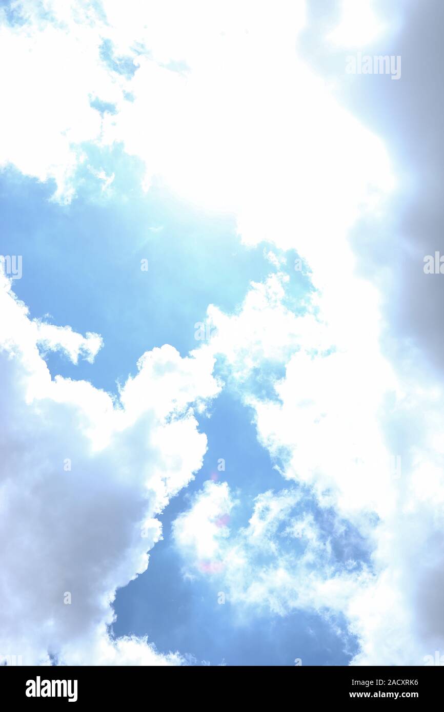 Blue sky with clouds and sun lights Stock Photo - Alamy