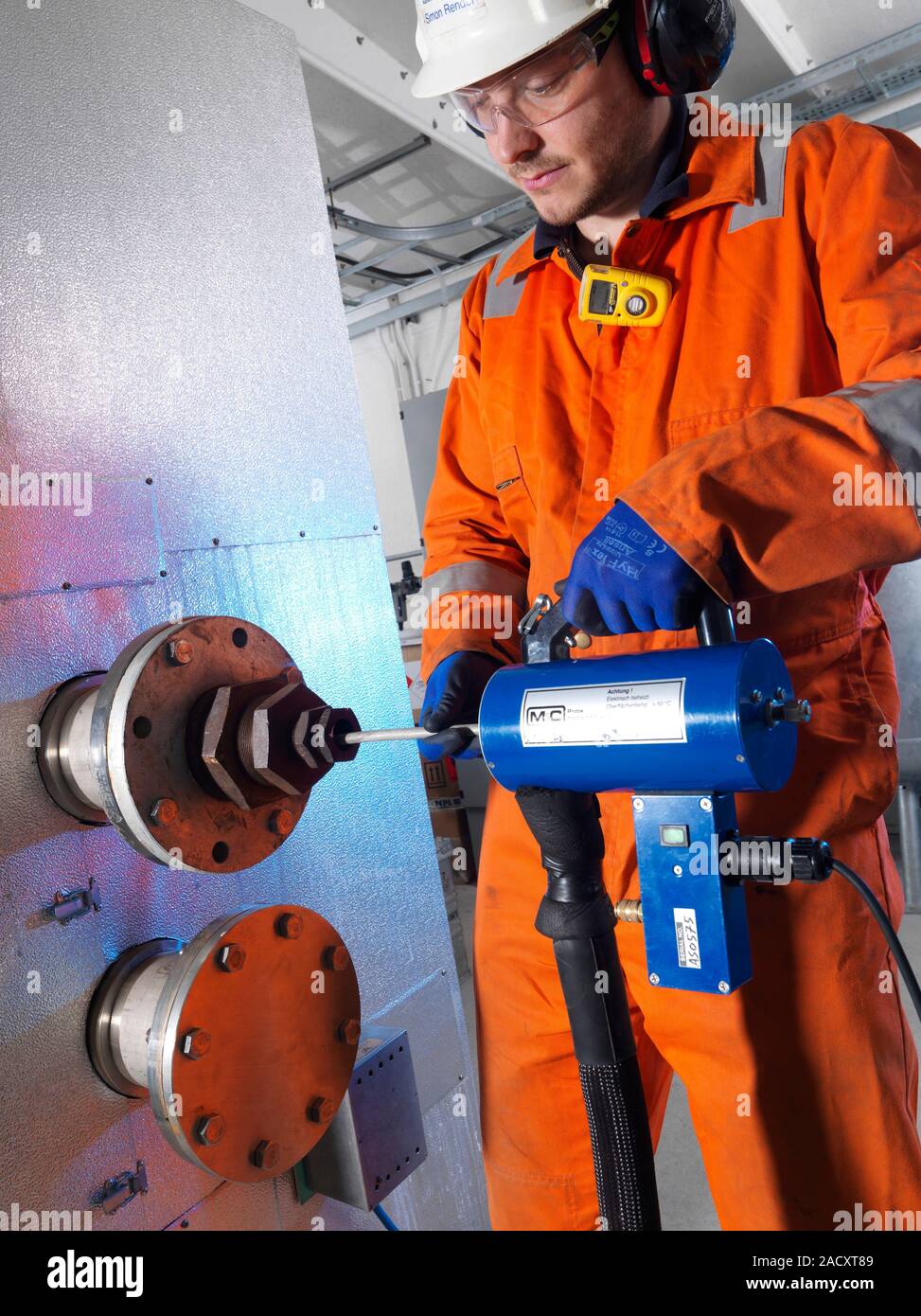 Chimney stack simulator. Researcher sampling gases from the stack ...