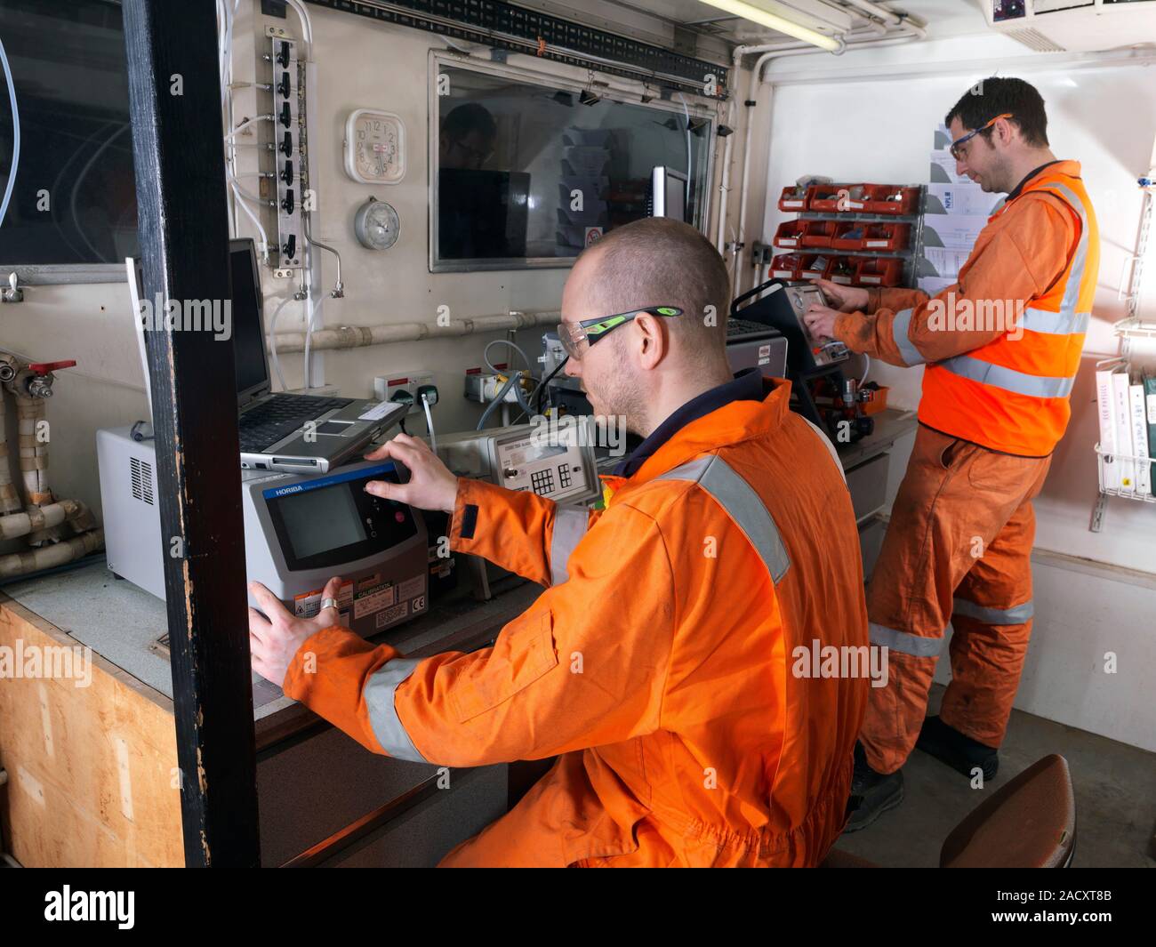 Chimney stack simulator. Researchers in an environmental chamber ...