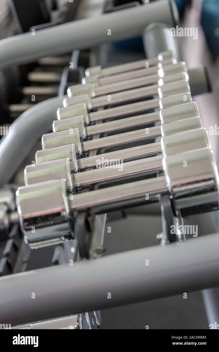 Rack of iron weights in a gym. Close up shot Stock Photo - Alamy