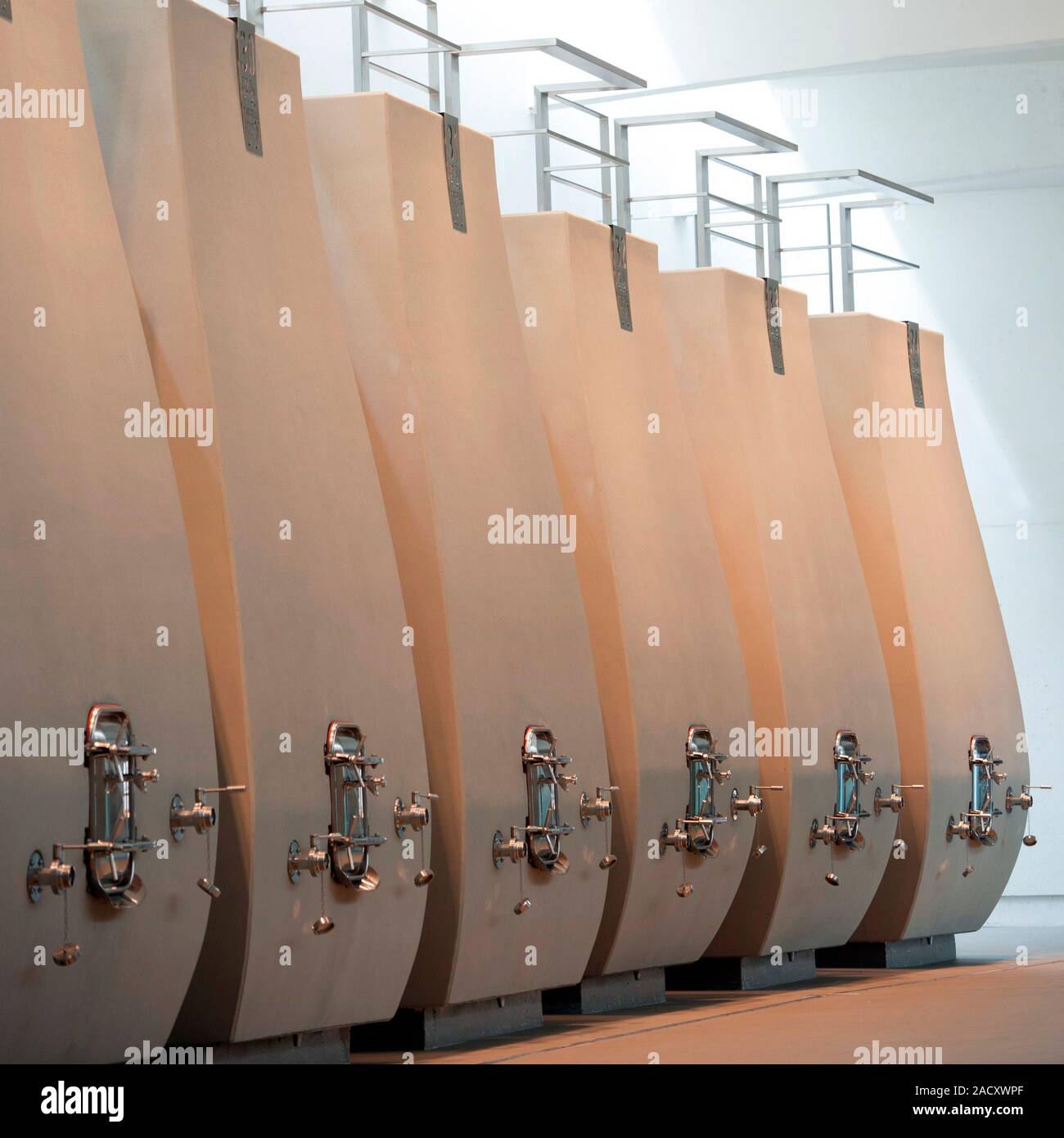 Concrete wine vats in the Cheval Blanc winery, Saint-Emilion, France ...