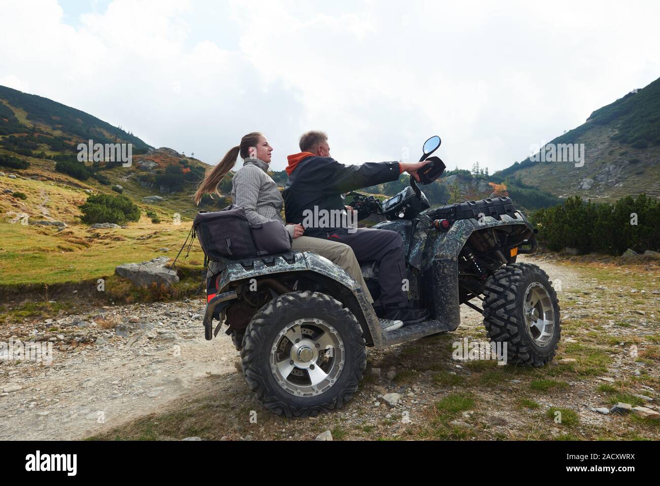 couple drive atv quad bike Stock Photo - Alamy