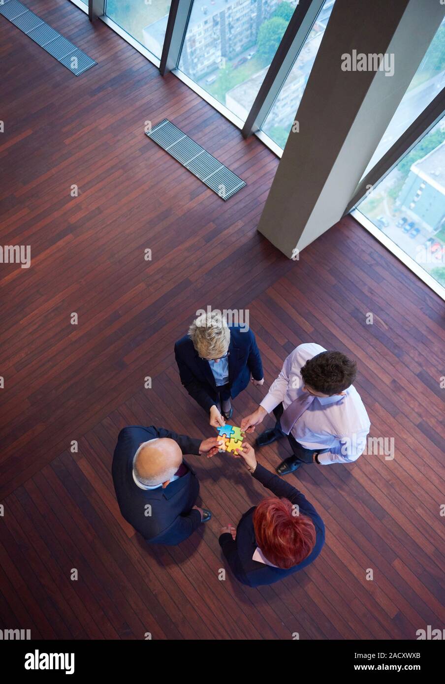 assembling jigsaw puzzle Stock Photo - Alamy
