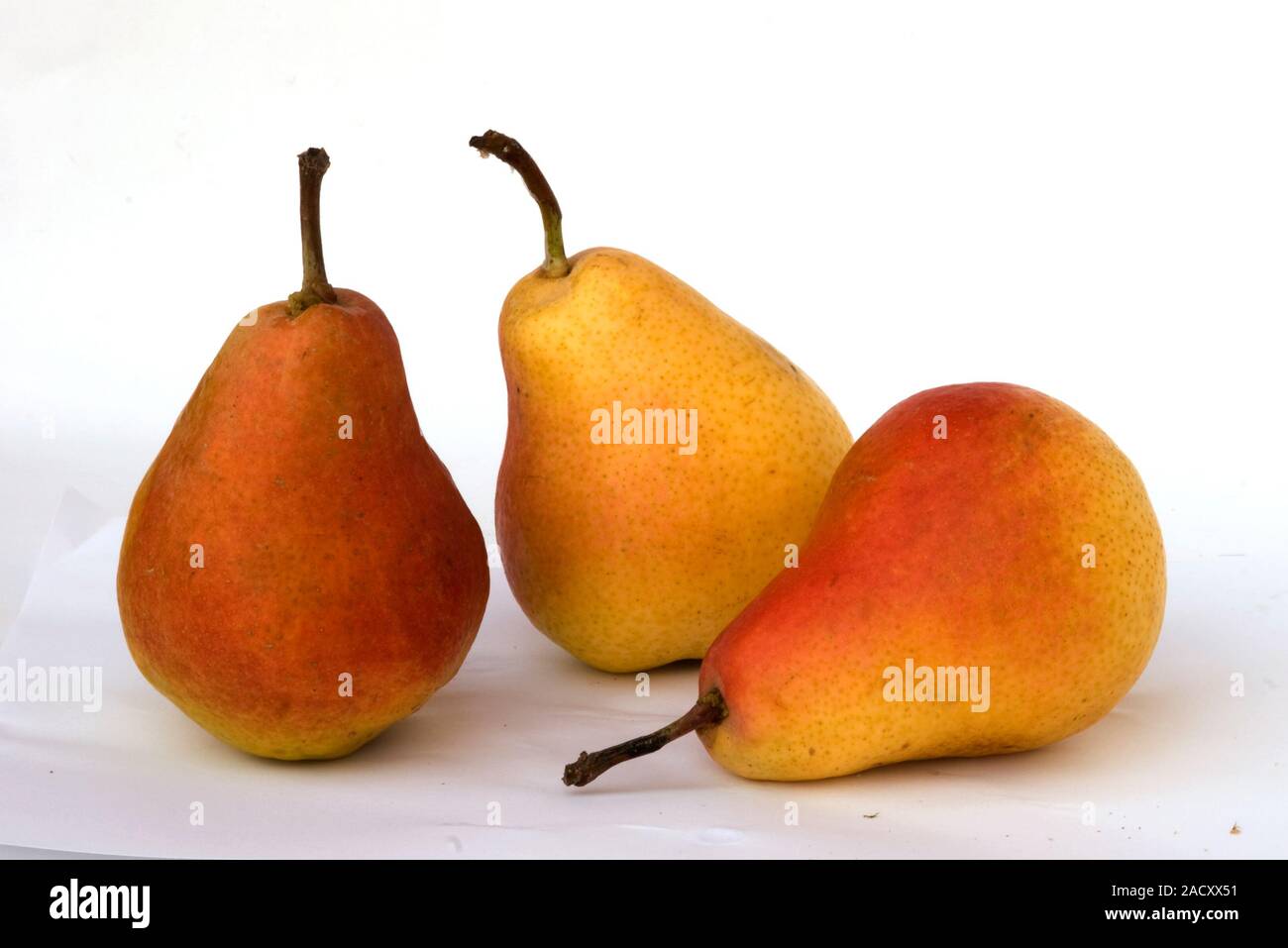 Three pears isolated on white background Stock Photo - Alamy