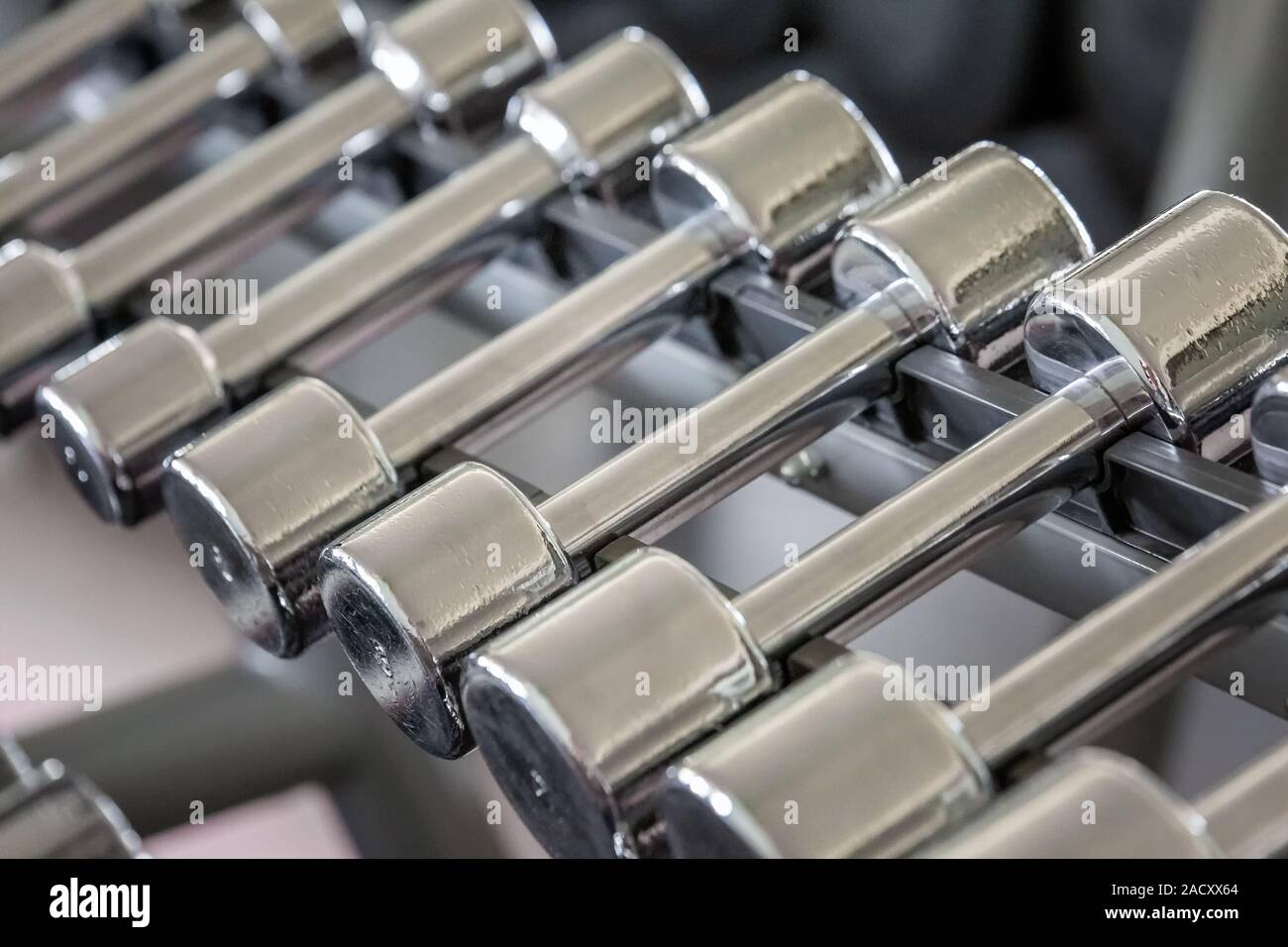 Rack of iron weights in a gym. Close up shot Stock Photo - Alamy
