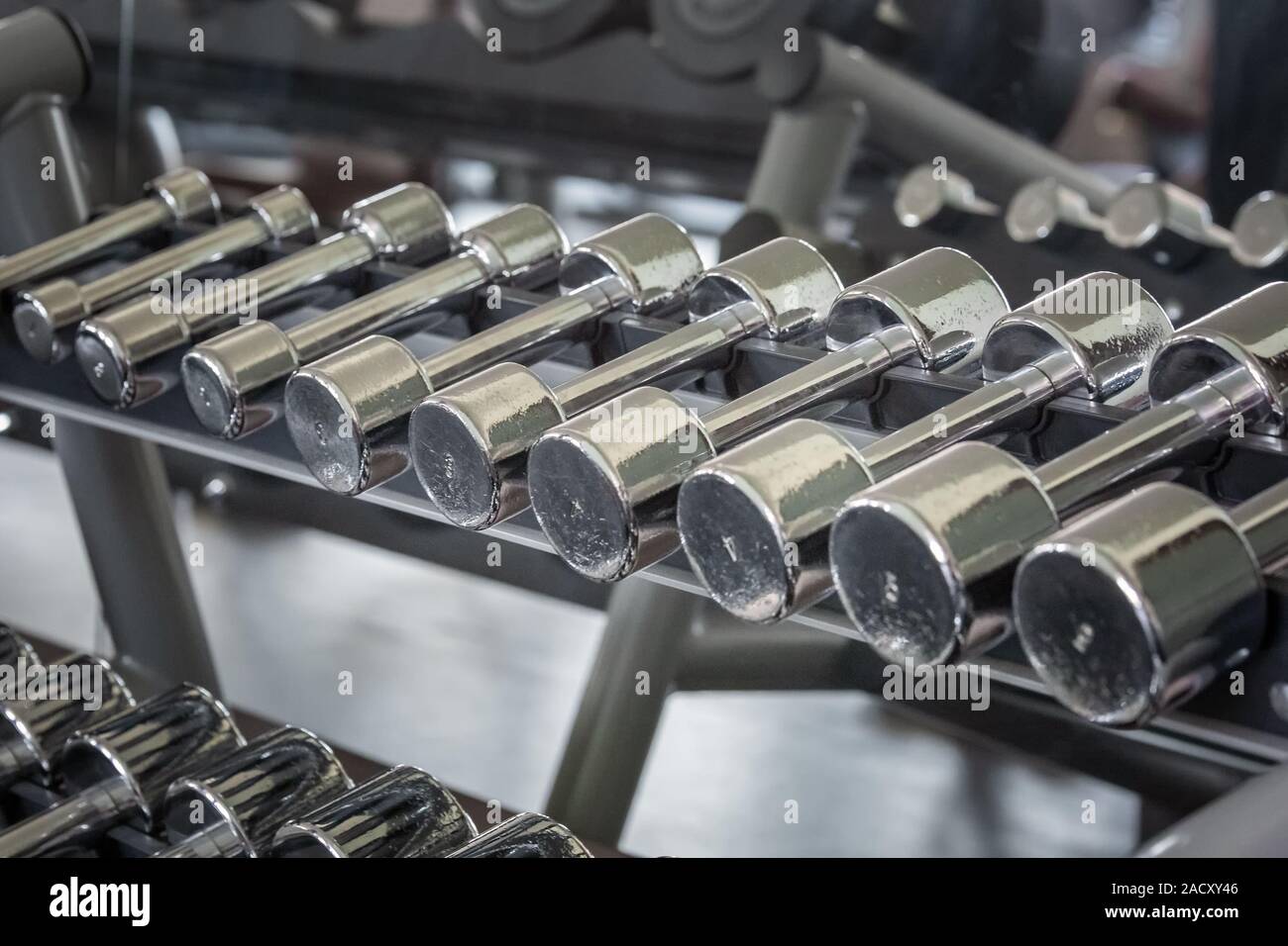 Rack of iron weights in a gym. Close up shot Stock Photo - Alamy