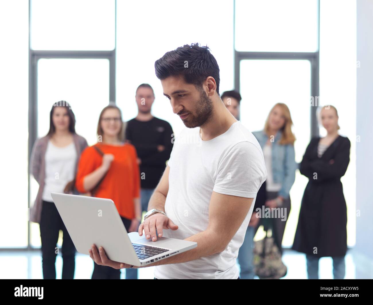 students group standing together as team Stock Photo - Alamy