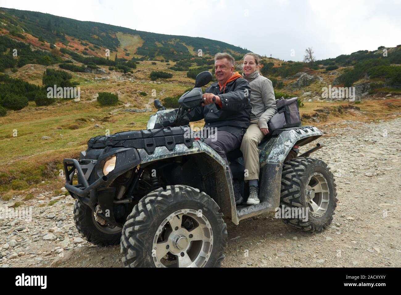 couple drive atv quad bike Stock Photo - Alamy