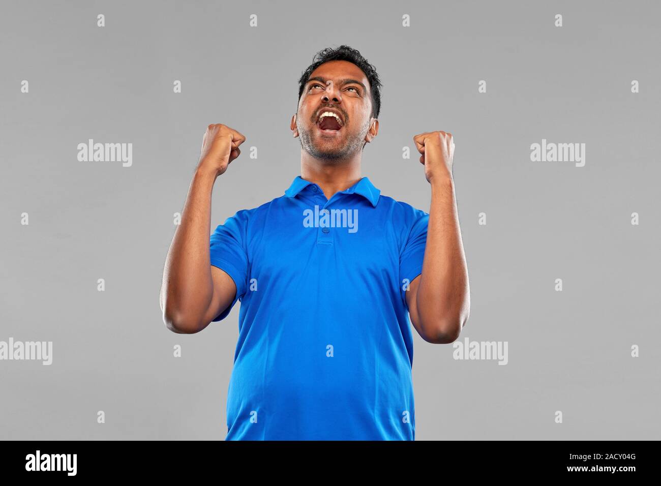 success, emotion and expression concept - happy young indian man ...