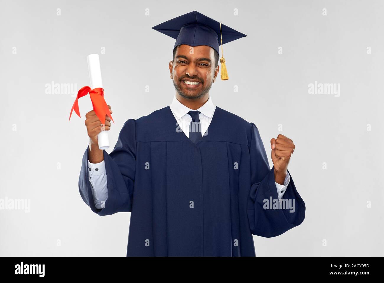 education, graduation and people concept - happy smiling indian male ...