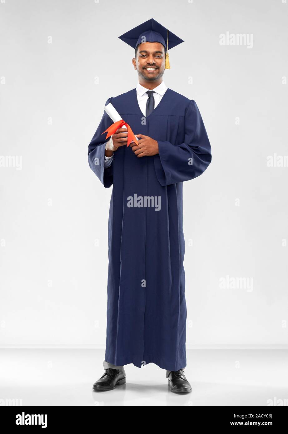 education, graduation and people concept - happy smiling indian male ...