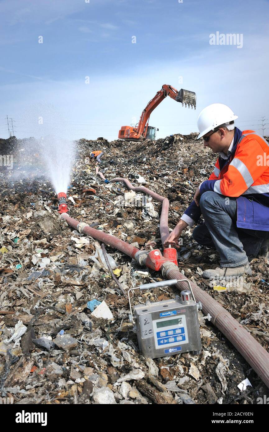 Waste disposal site control measures. Environmental protection workers ...