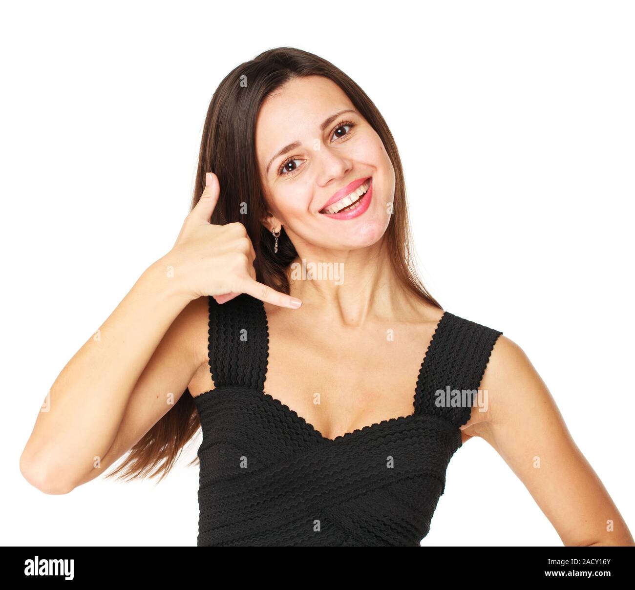 Beautiful brunette woman making a call me gesture Stock Photo - Alamy