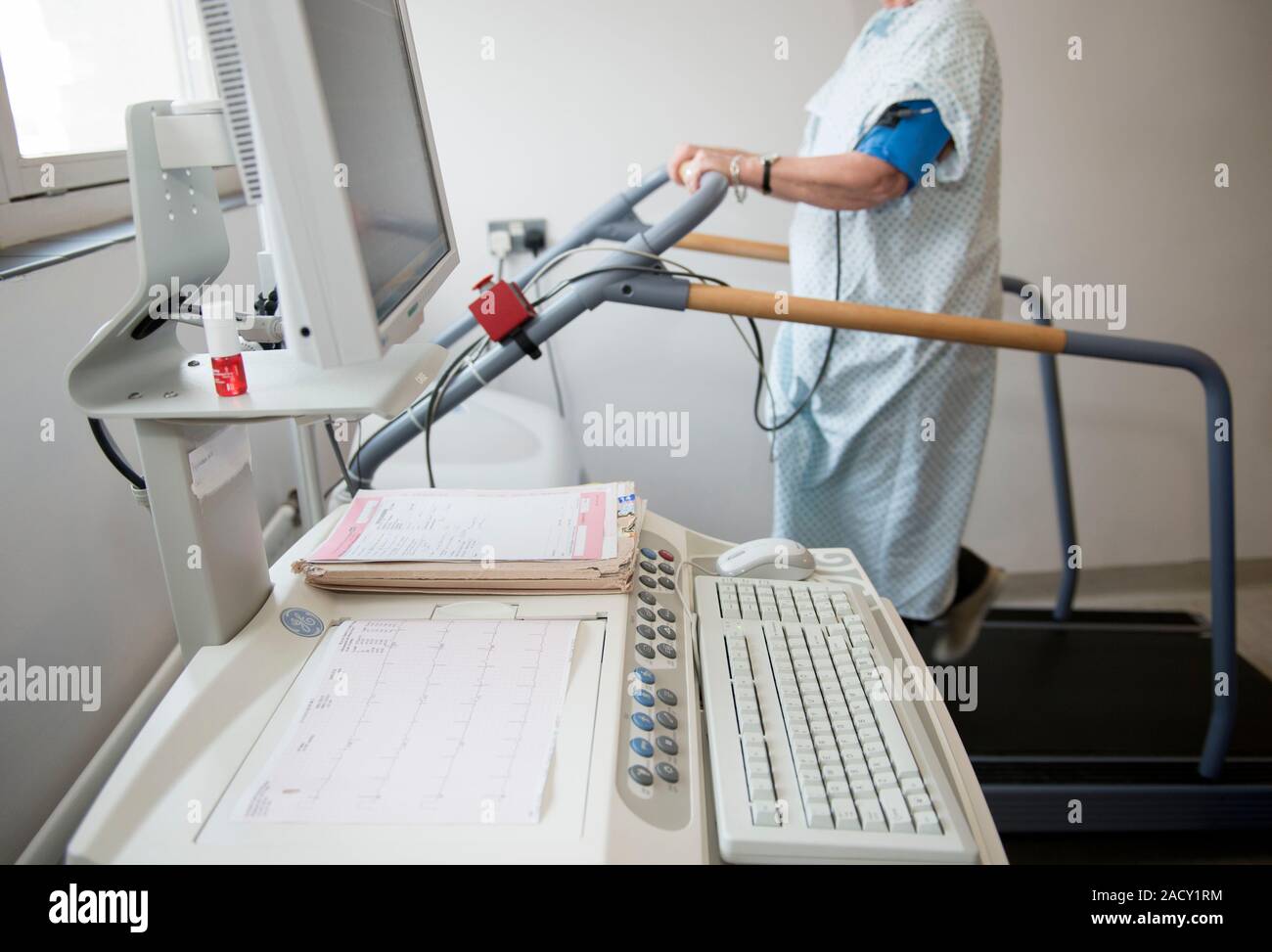 Exercise ECG. A patient undergoing exercise testing on a treadmill ...