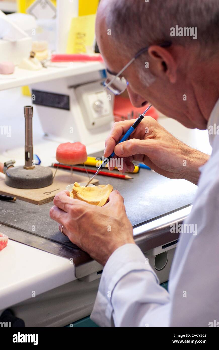 Making dentures. Person making dentures Stock Photo - Alamy