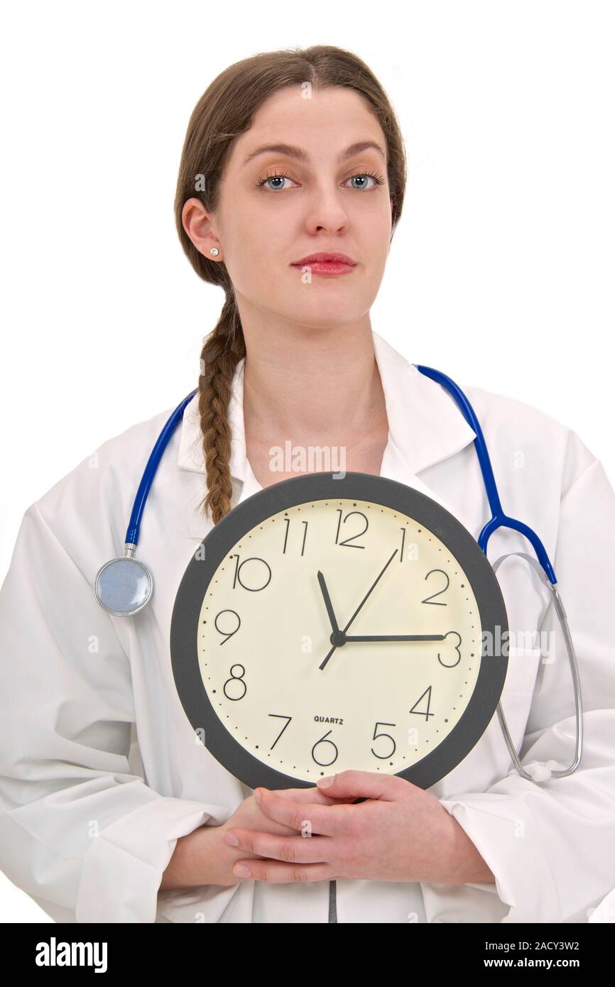 Medical time. Conceptual image of a doctor with stethoscope holding a ...