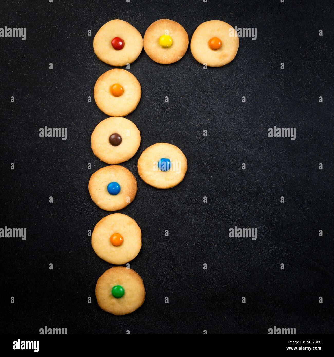 Homemade child cookies - F letter of the alphabet Stock Photo - Alamy
