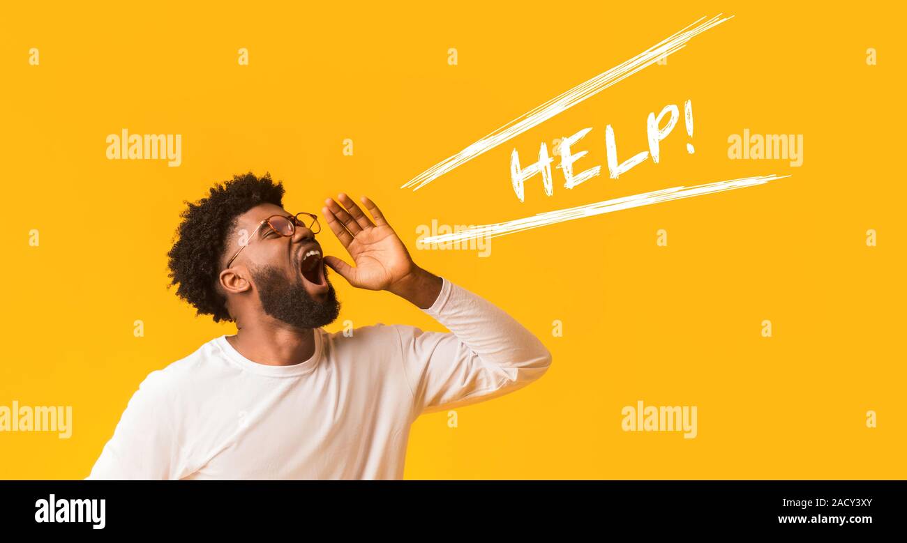 Worried afro guy shouting help over orange background Stock Photo - Alamy