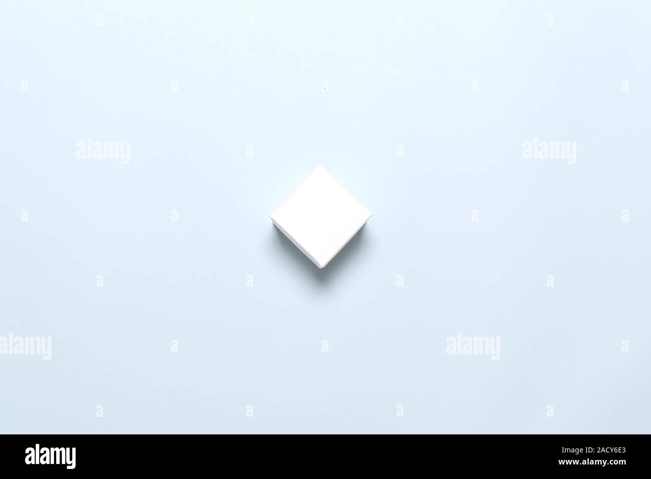 White generic box for mockup product presentation on blue background ...