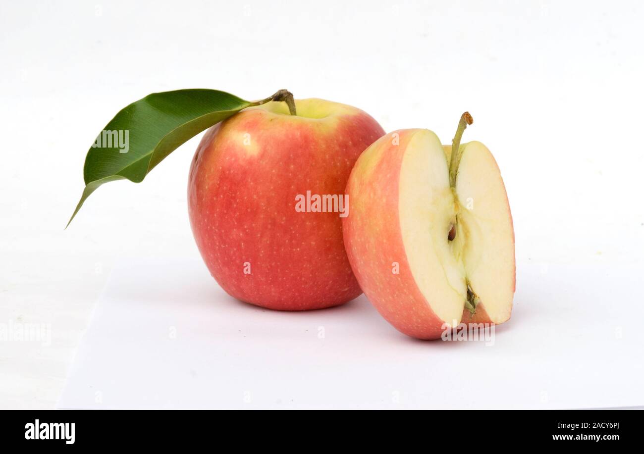 Red apple and section isolated on white background Stock Photo - Alamy