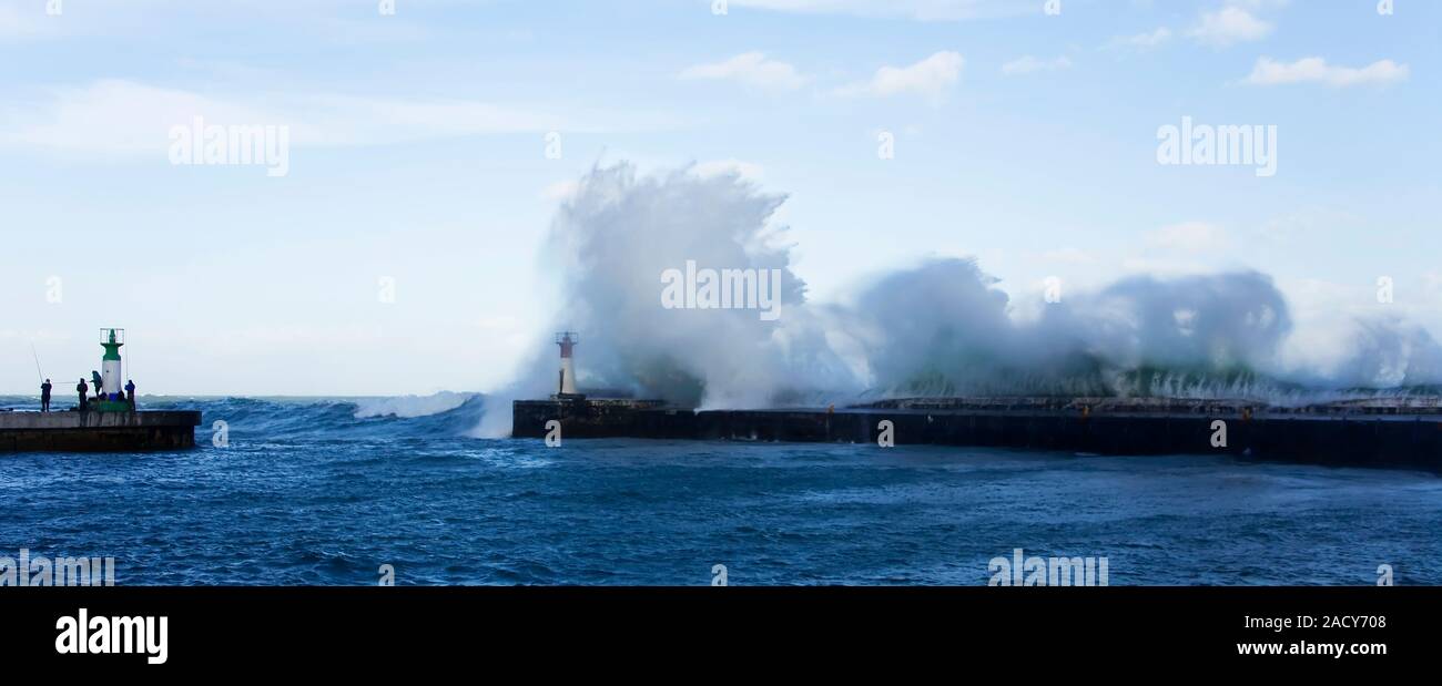 Waves crashing over lighthouse in Kalk Bay Harbour as fishermen brave ...