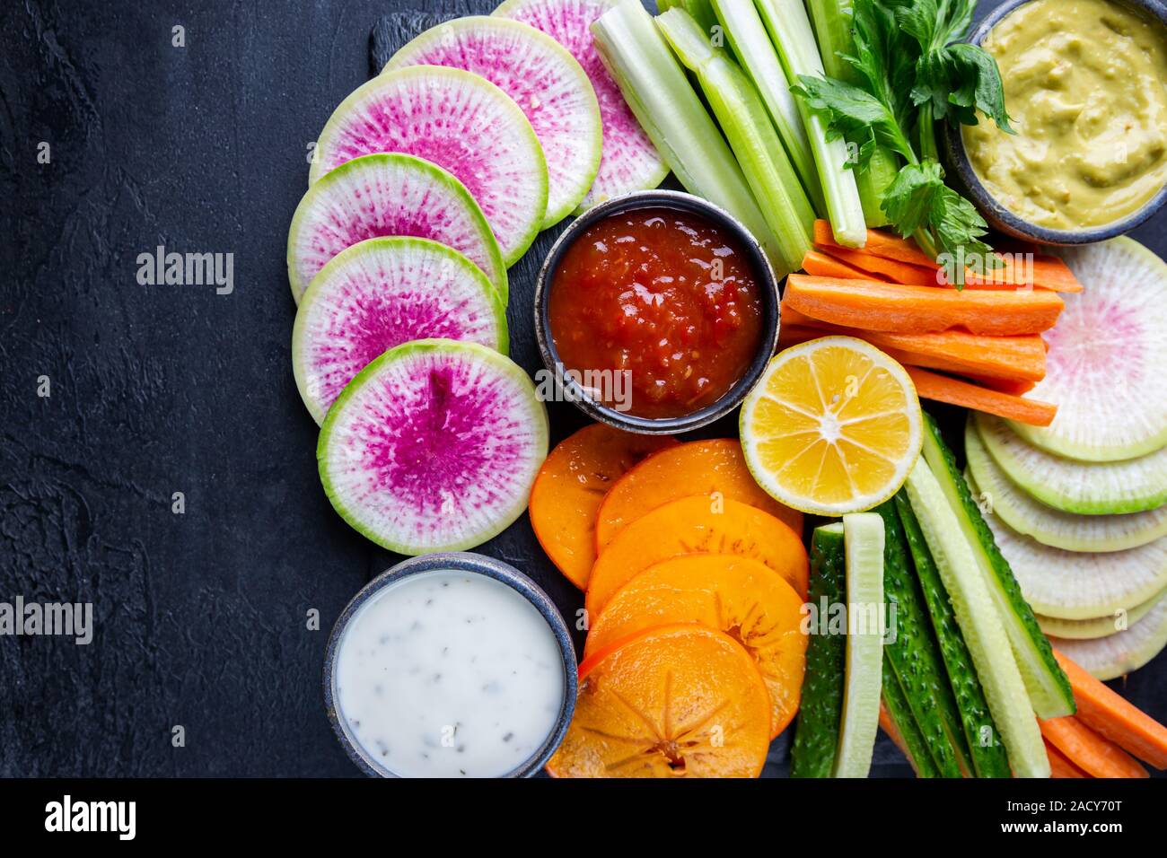 Buddha bowl of mixed raw snacks. vegetables with sauces carrots ...