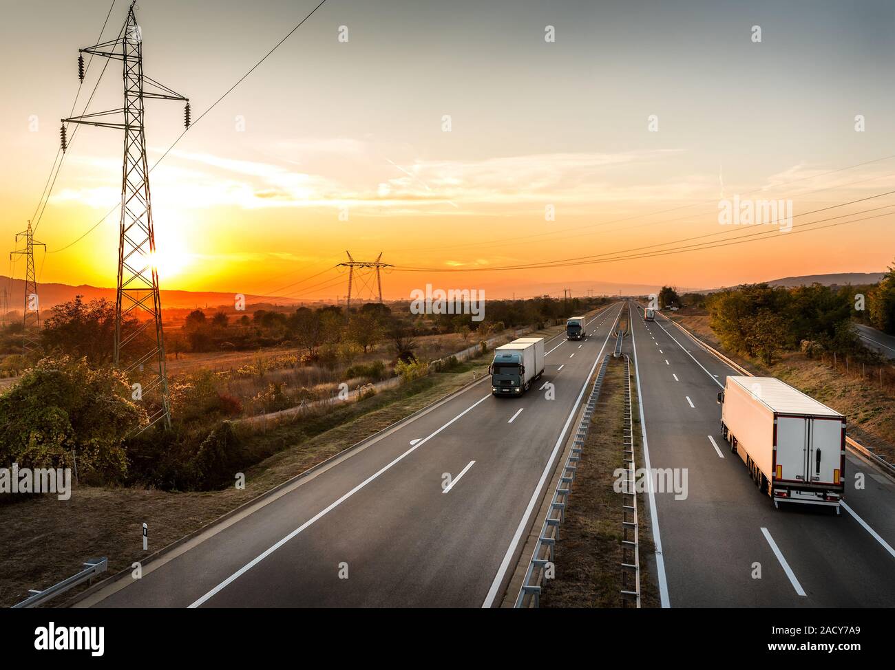 Lorry trucks passing each other on a highway. Highway transportation ...