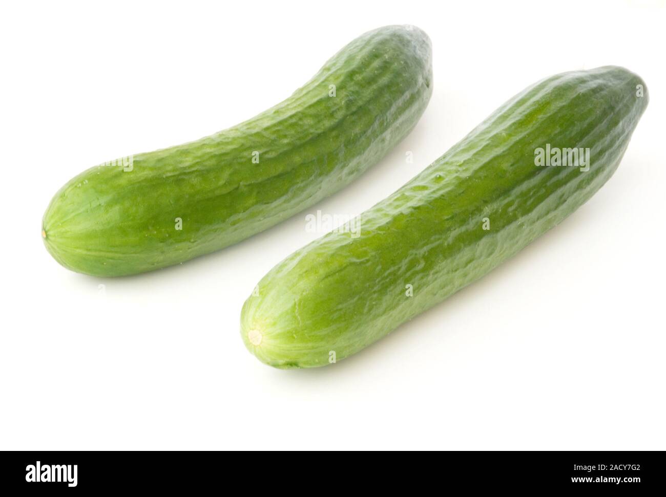 Two cucumbers isolated on white background Stock Photo - Alamy