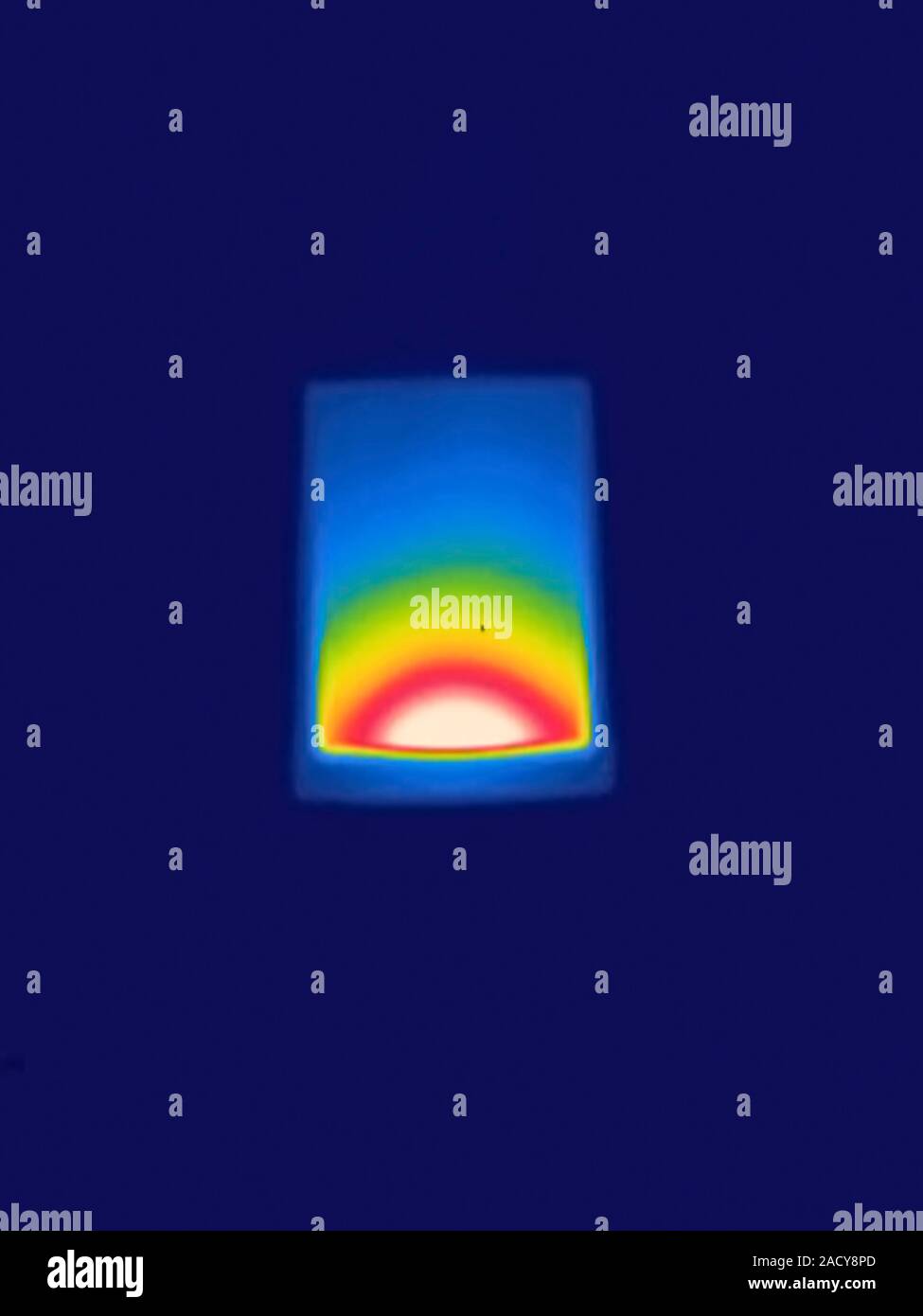 Thermogram of a halogen light fixture. The temperature scale runs from ...