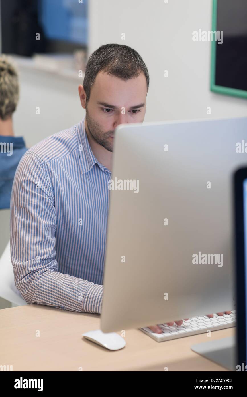 startup business, software developer working on desktop computer Stock Photo - Alamy
