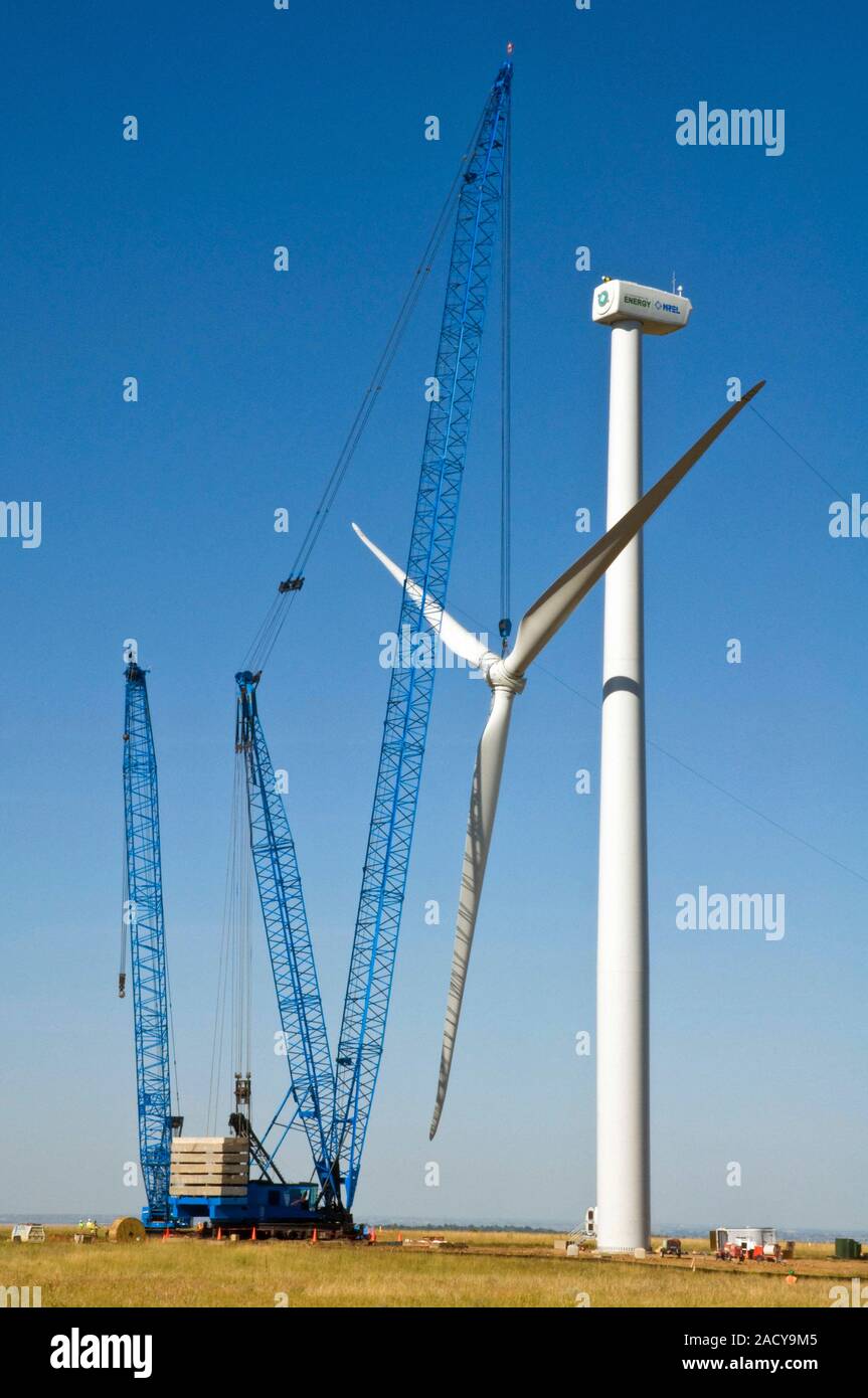 Installing a wind turbine. Blade being lifted into position during the ...