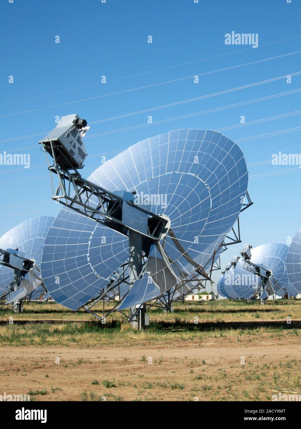 Concentrating solar power plant. Array of Stirling engine heliostats ...