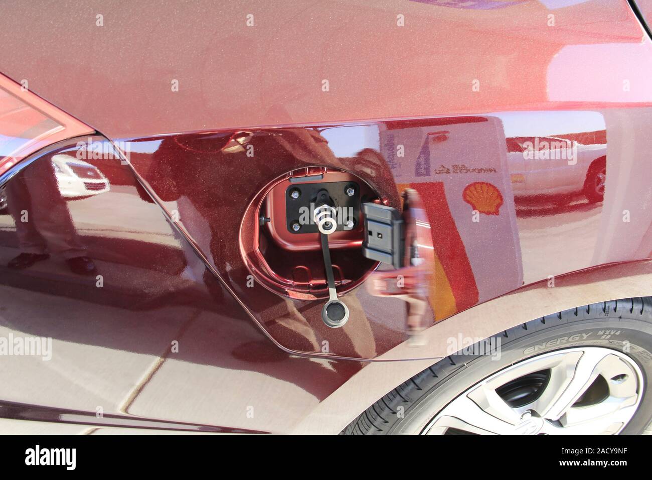 Hydrogen fuelling station. Close-up of a hydrogen-powered vehicle's ...