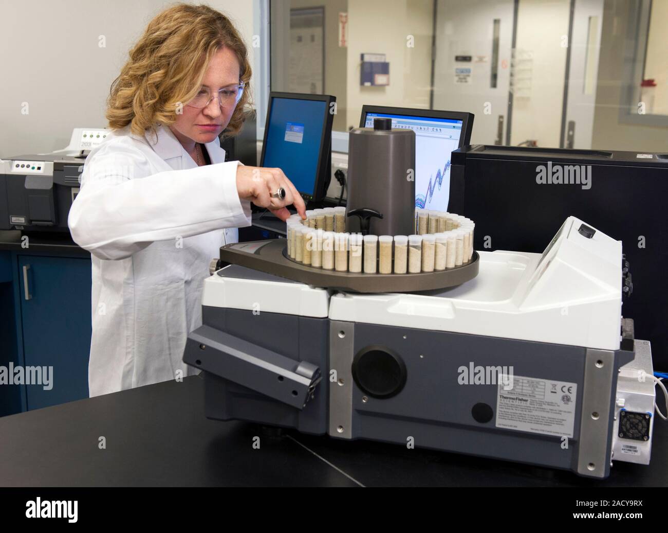 Biomass analysis. Scientist analysing corn stover (crop residue) using ...