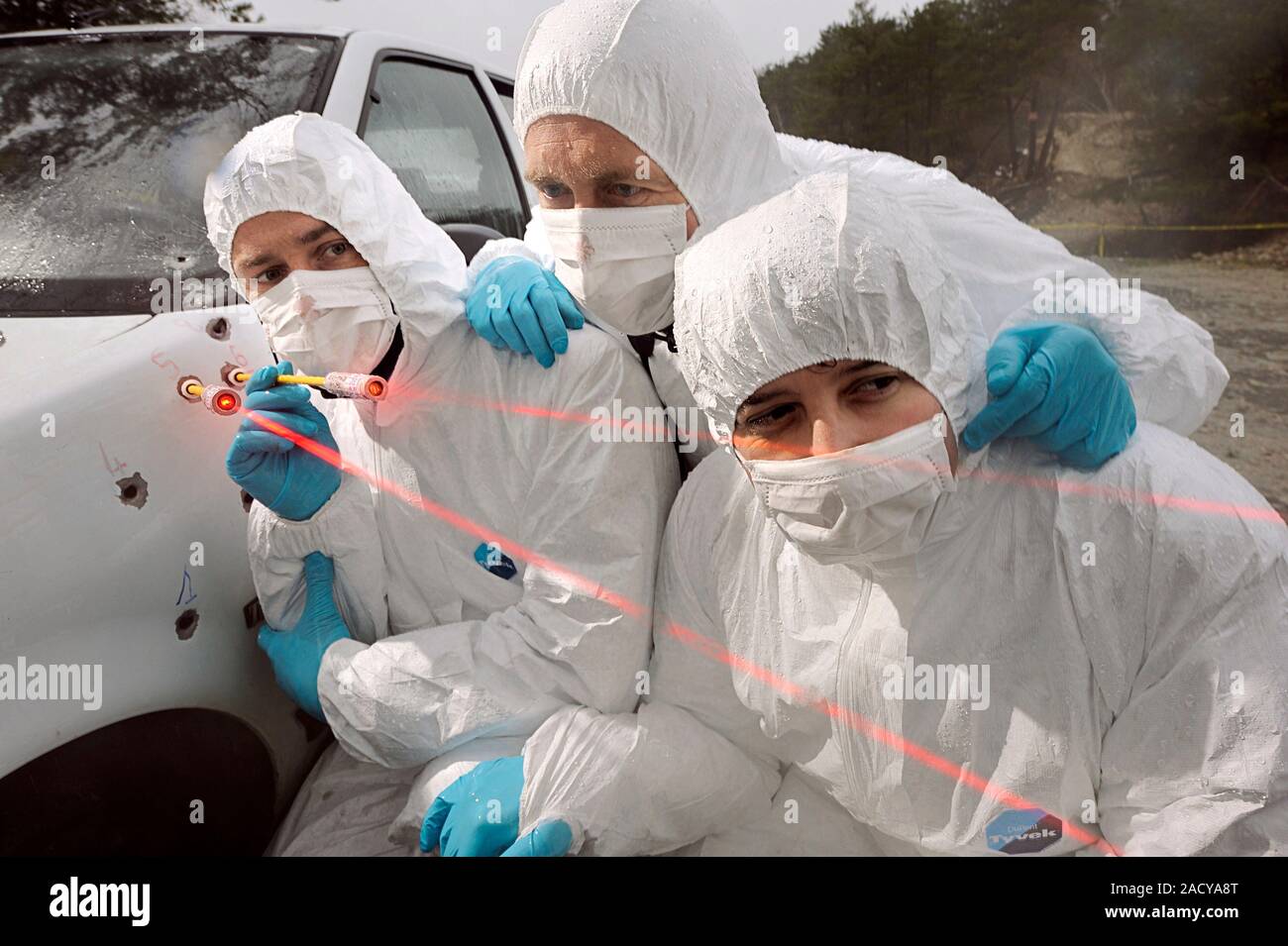 Policeman undergoing forensic training. They are using lasers to ...