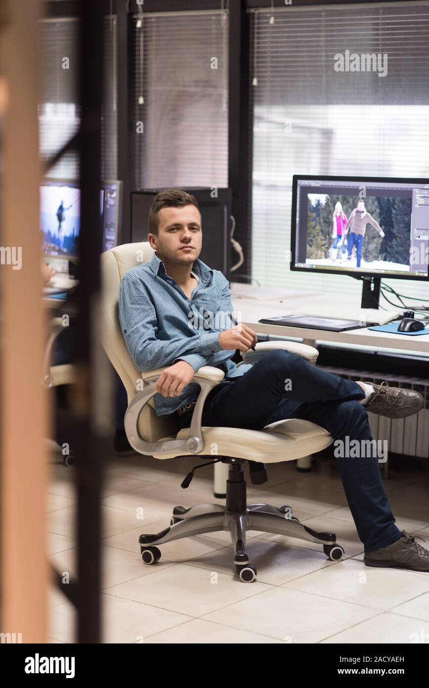 photo editor at his desk Stock Photo - Alamy