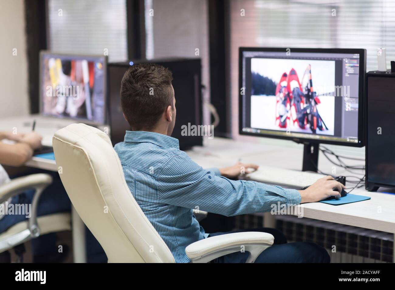 photo editor at his desk Stock Photo - Alamy