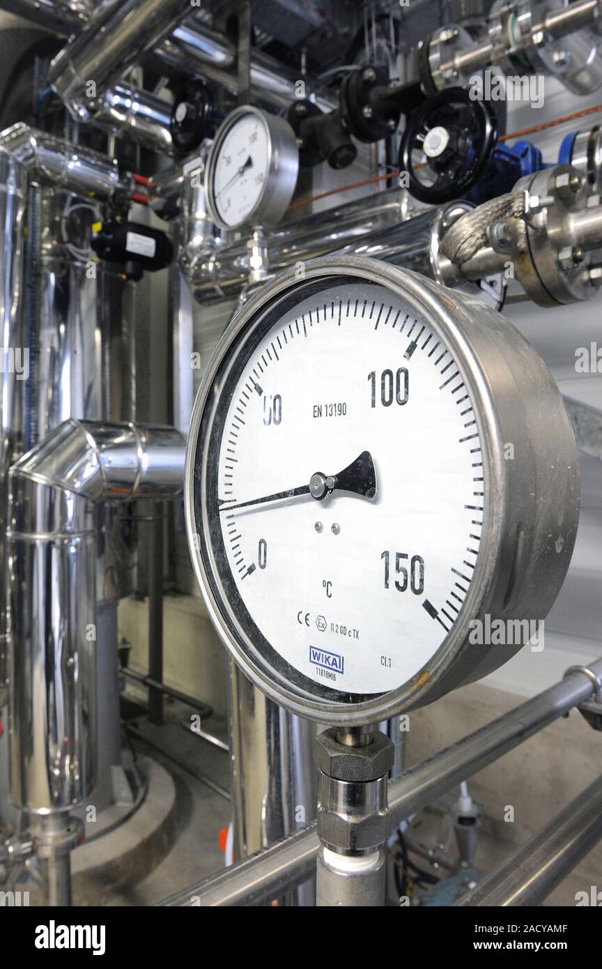 Bioethanol fuel production. Temperature gauge on distillation apparatus ...