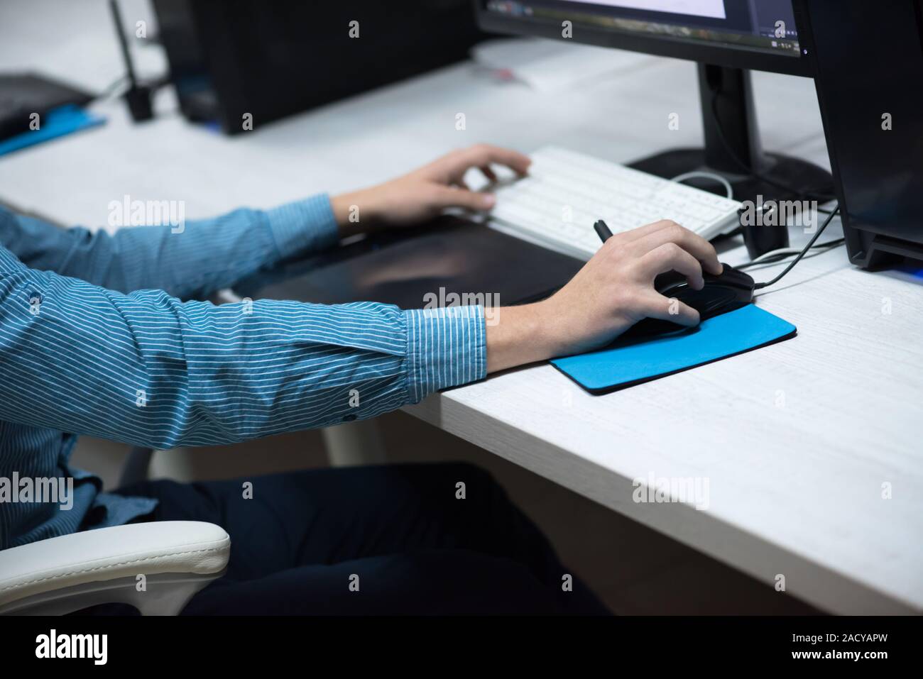 photo editor at his desk Stock Photo - Alamy